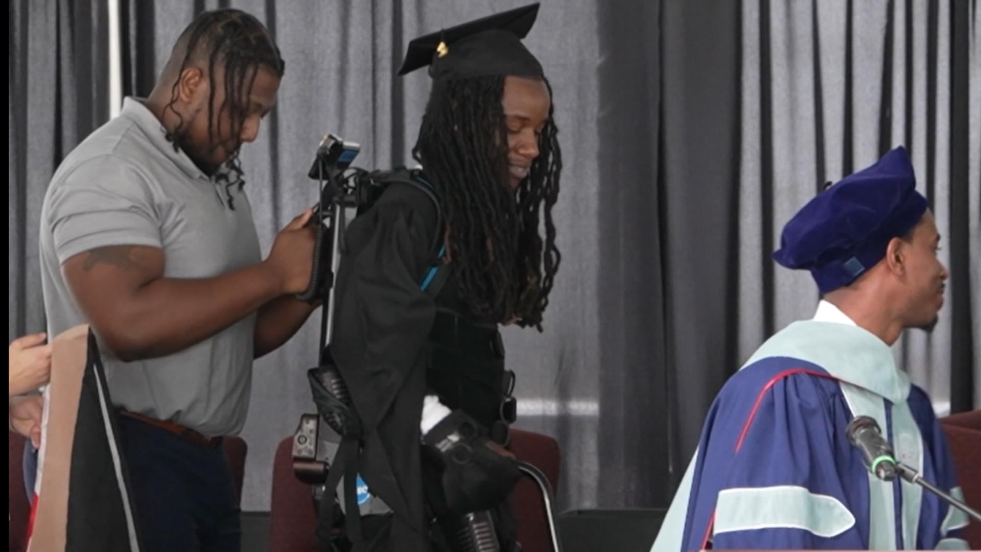 Paralyzed Virginia graduate walks across stage with help from robotic ...