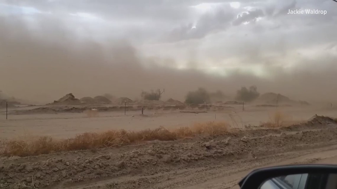 Dust storm rolls past car in Surprise | 12news.com
