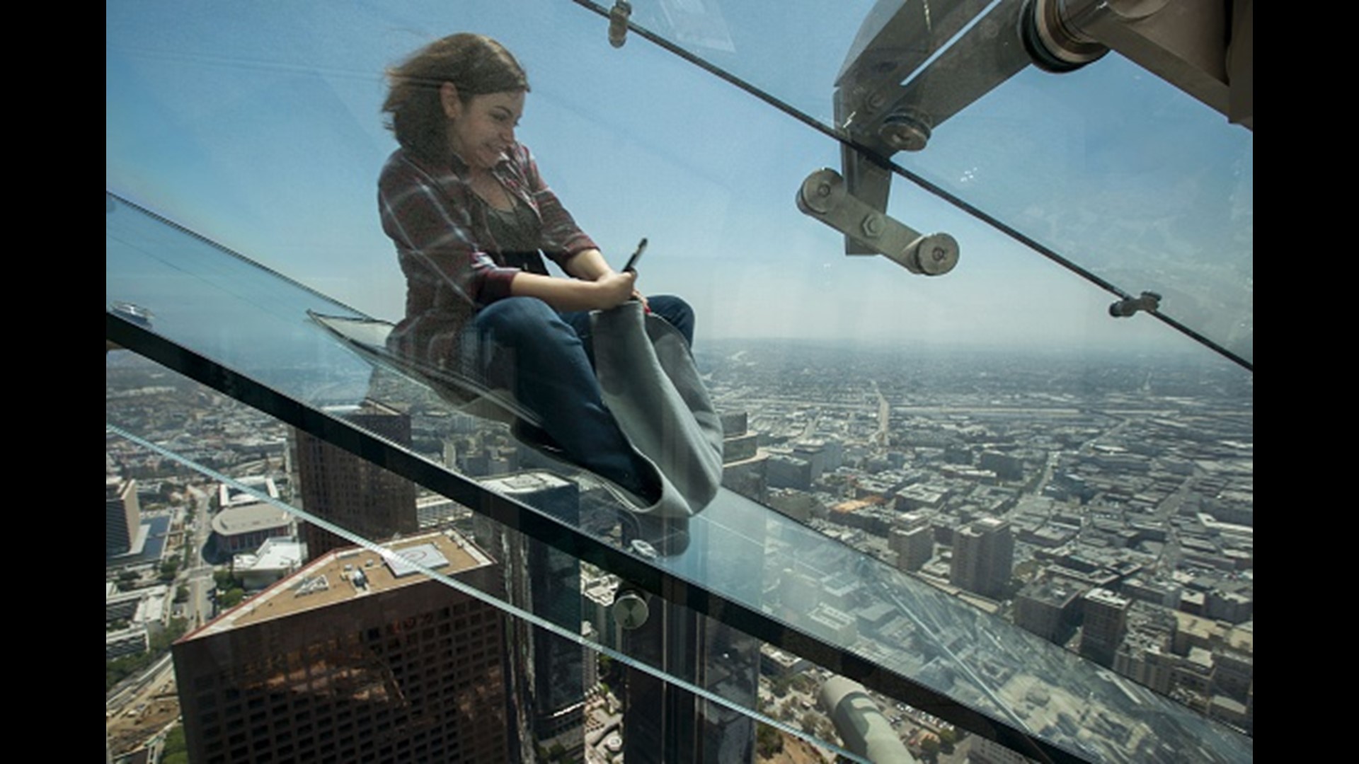 Taking a ride on a 1,000-foot-high glass skyslide | 12news.com