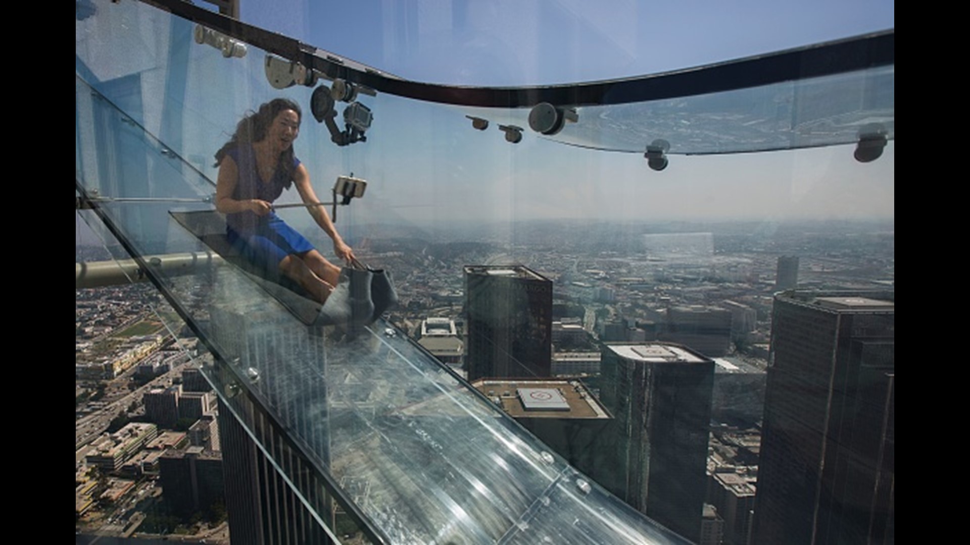 Taking a ride on a 1,000-foot-high glass skyslide | 12news.com