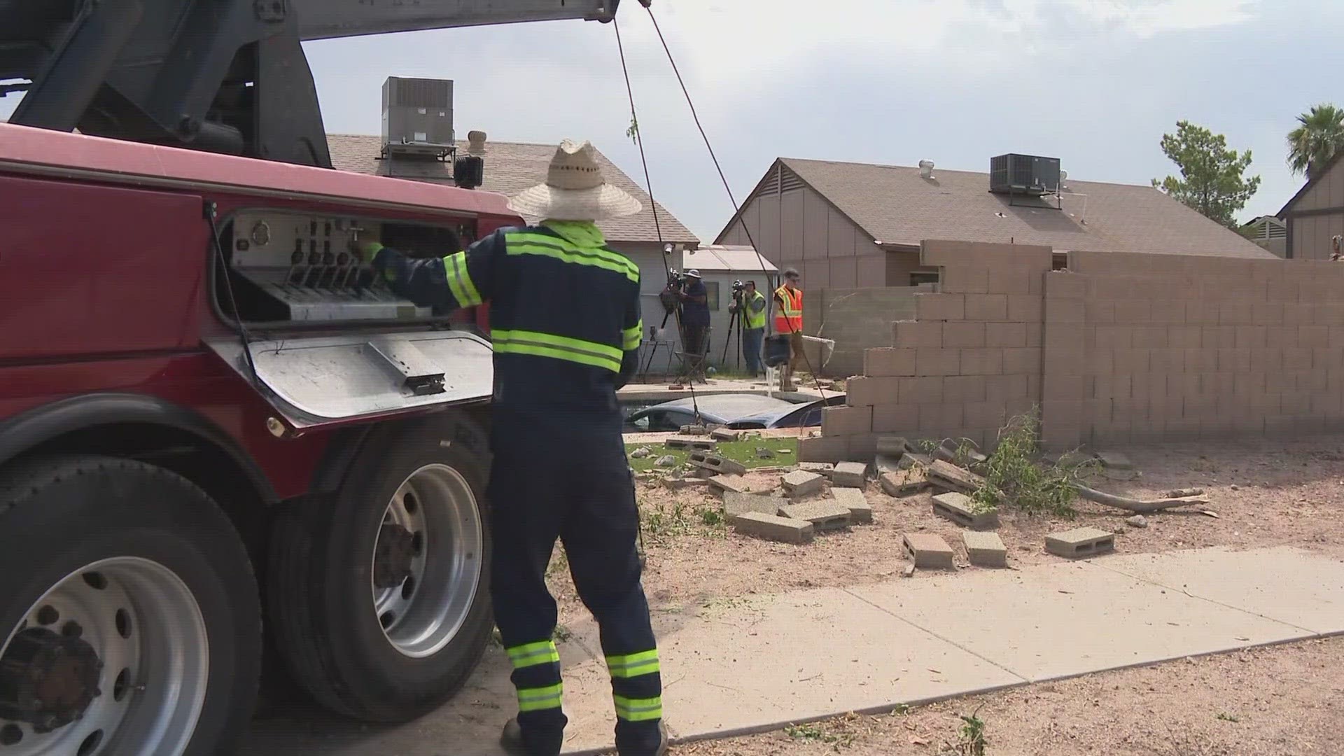 Tesla crashes into Phoenix pool, driver escapes unharmed | 12news.com