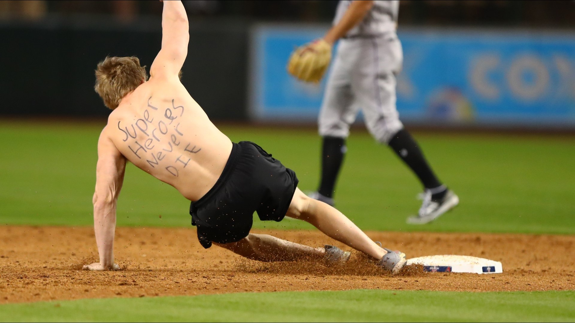 Shirtless fan arrested after running on field during D-backs season ...