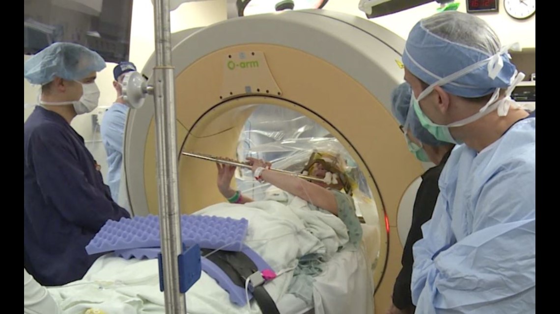 Woman plays flute while undergoing brain surgery | 12news.com