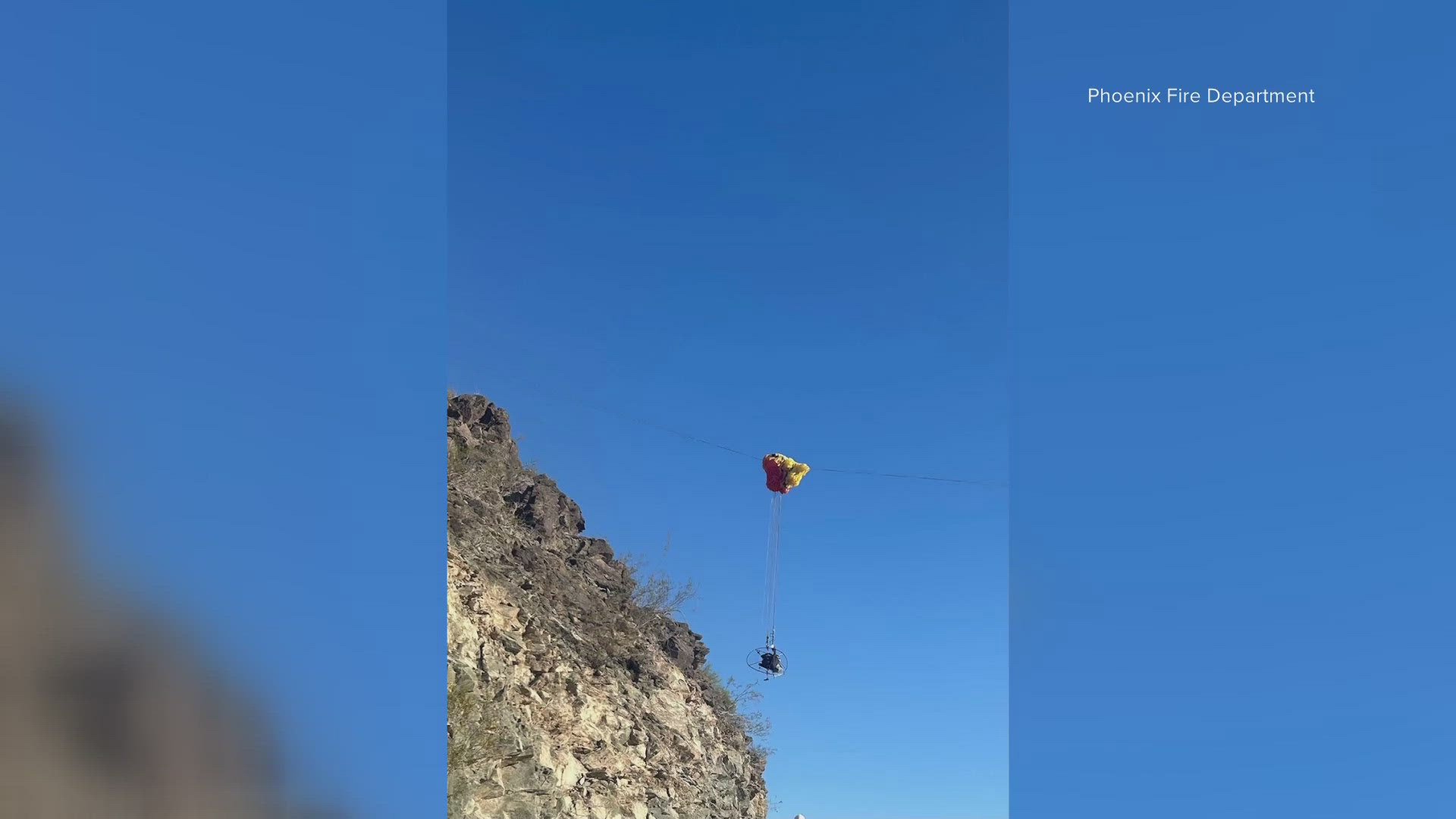 Paraglider rescued after crash into power pole | 12news.com