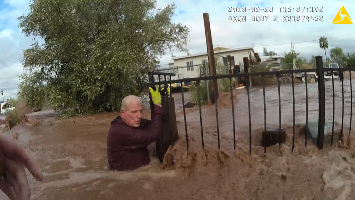 WATCH: Officer's body cam captures rescue of man found clinging to ...