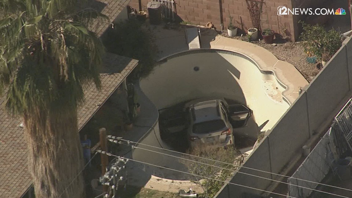 Car ends up in empty pool of north Phoenix home after crashing through ...