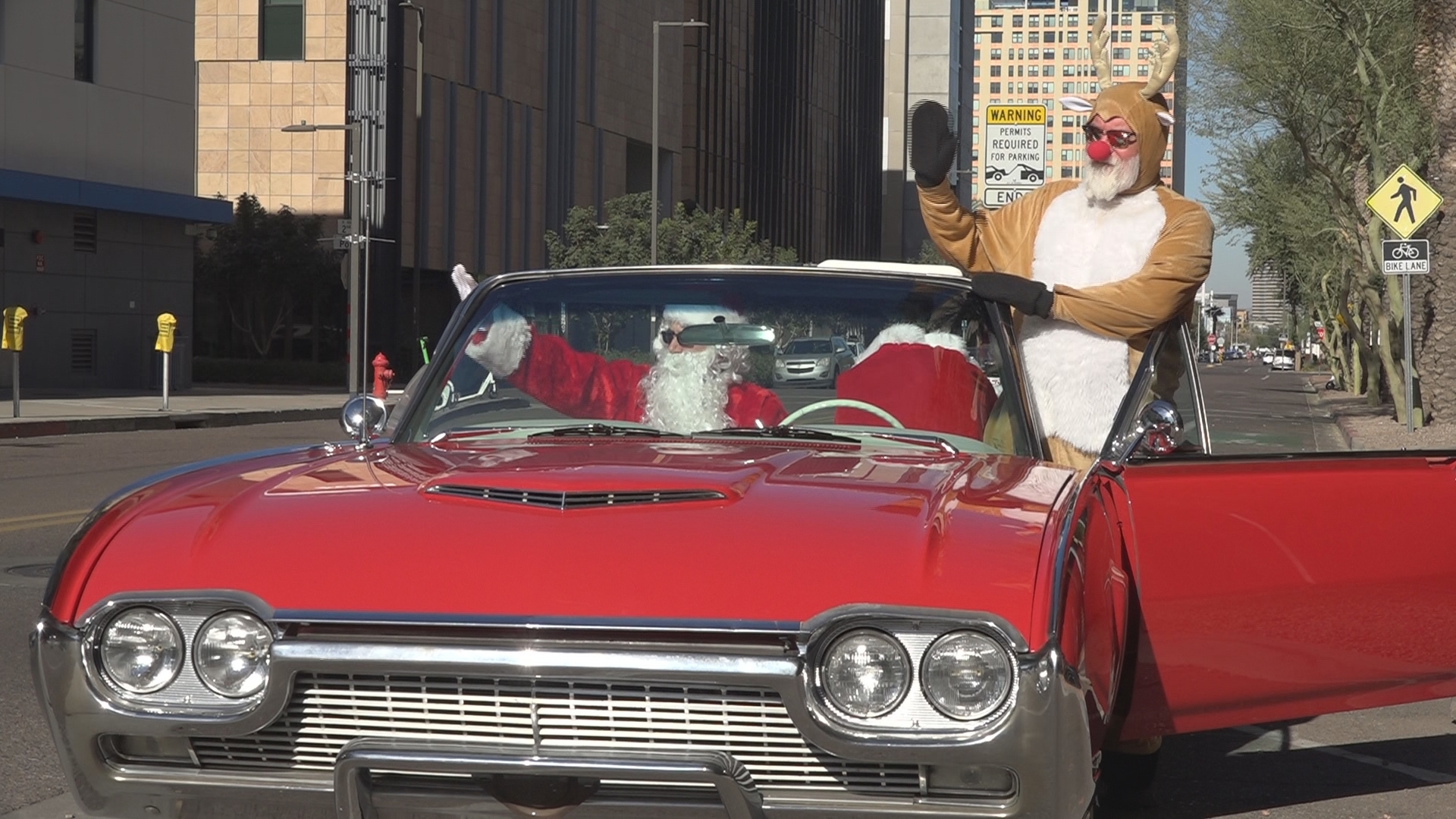 Santa and Rudolph driving in downtown Phoenix in a '61 Ford Thunderbird ...