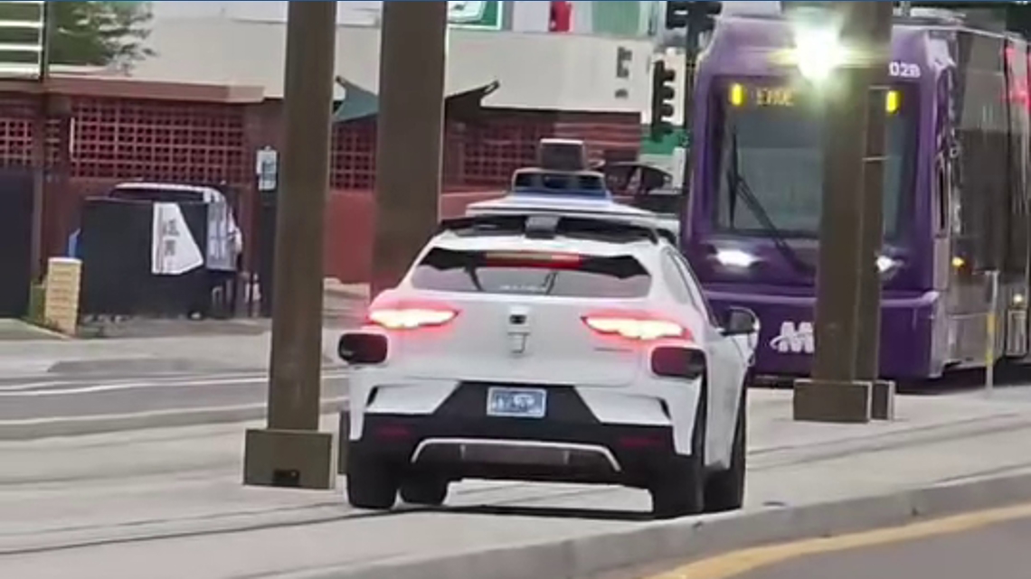 Waymo car seen driving on light rail tracks in Phoenix | 12news.com