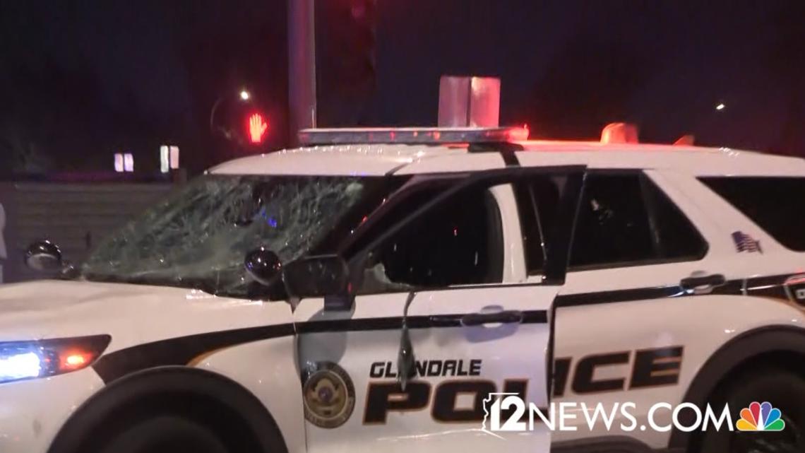 VIDEO: Suspect in mask jumps into Glendale police car, drives it during ...