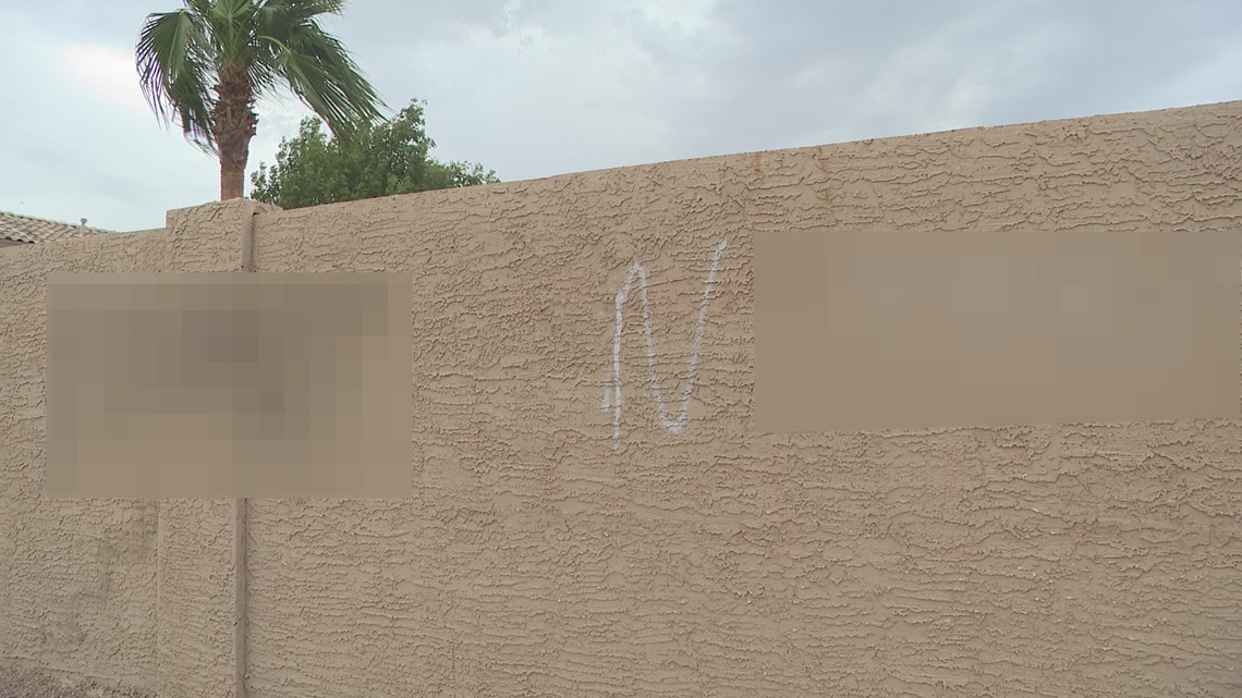 Racial slurs spray painted on wall near Mesa family's home | 12news.com