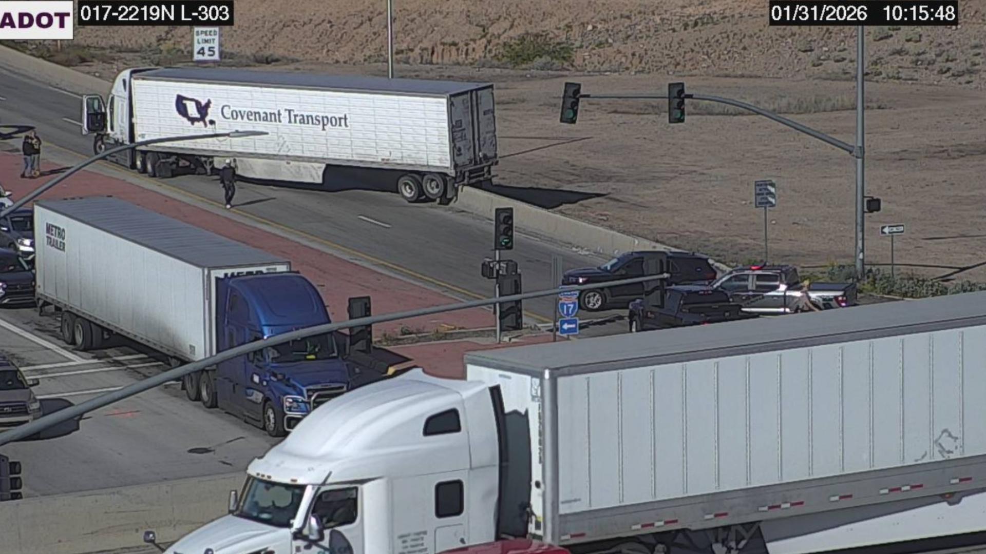 Semi-truck gets stuck on barrier in north Phoenix | 12news.com