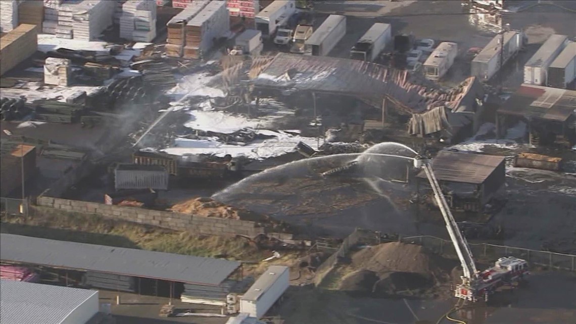 Sky 12 over the aftermath of large fire at Phoenix pallet yard | 12news.com