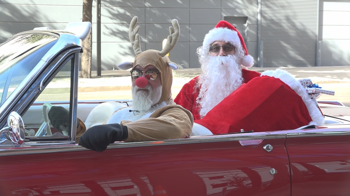 Santa and Rudolph driving in downtown Phoenix in a '61 Ford Thunderbird | 12news.com