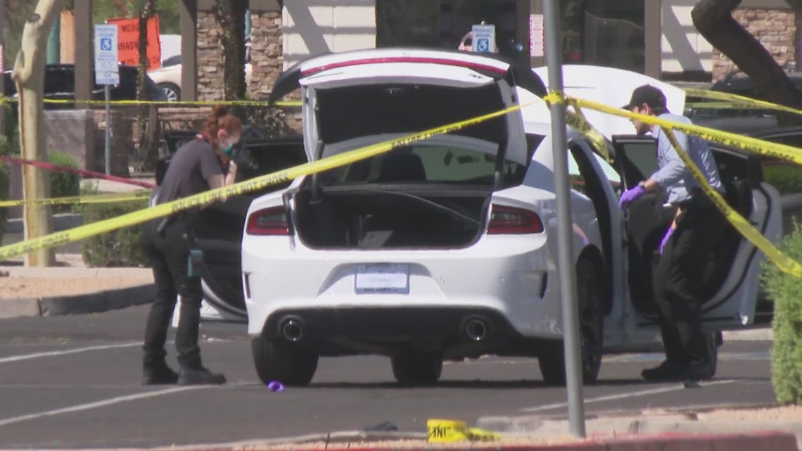 Community reacts after an officer was shot during an armed robbery in ...