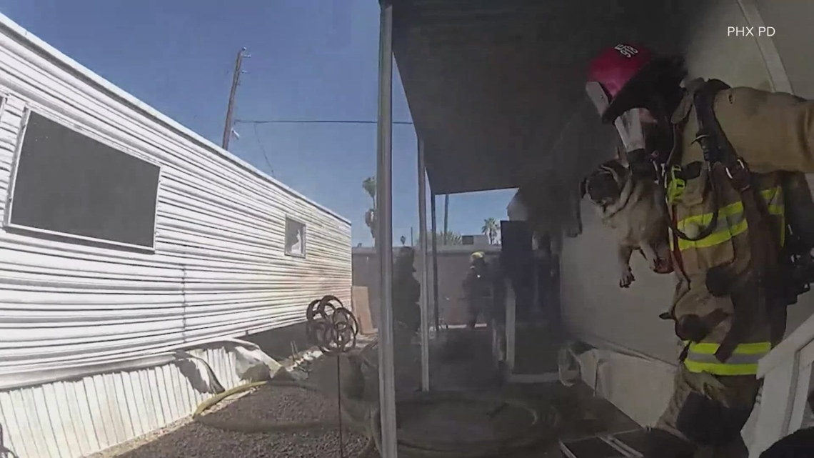 Body-cam footage reveals dramatic pet rescue from mobile home fire in ...